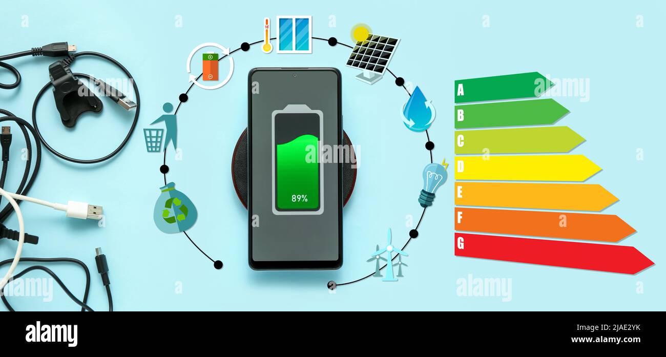 Modern mobile phone and wireless charger pad on blue background ...