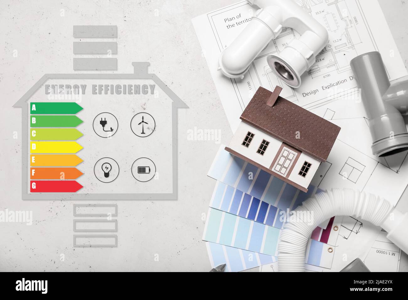 Model of new house with drawings, color samples, plumbing pipes and ...