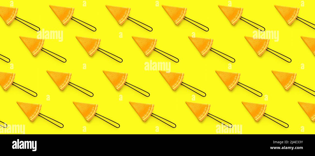 Many slices of tasty pumpkin pie on yellow background. Pattern for ...