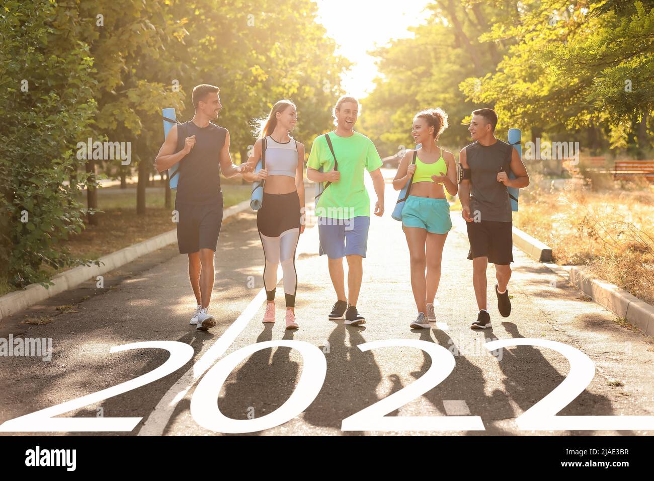 Sporty people near figure 2022 on road. Concept of new goals Stock ...