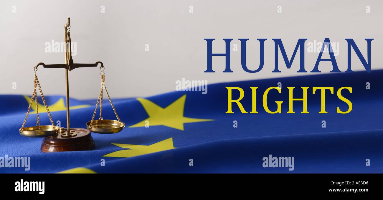 Scales of justice with European Union flag and text HUMAN RIGHTS on ...