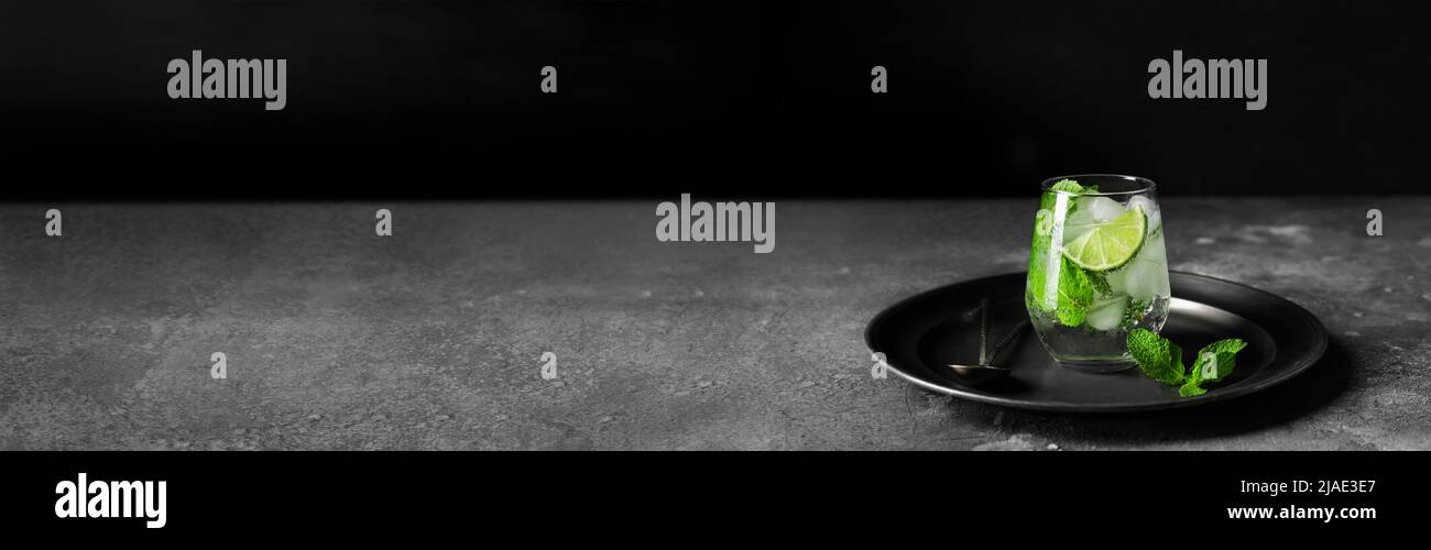 Glass of fresh mojito on grunge table. Banner for design Stock Photo ...