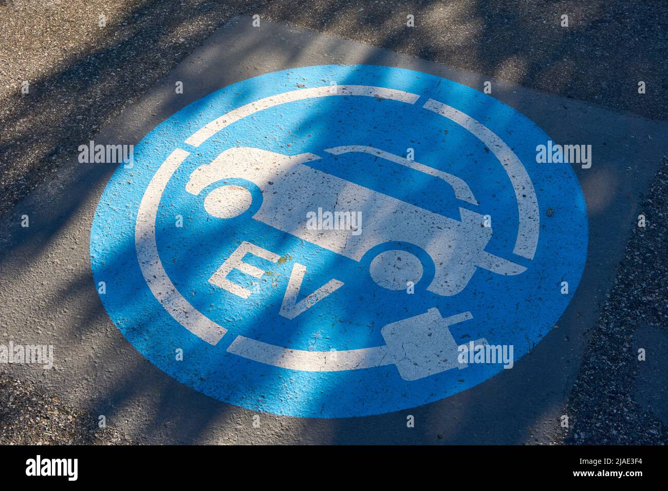 Closeup of an electric vehicles EV fast charging station symbol painted ...
