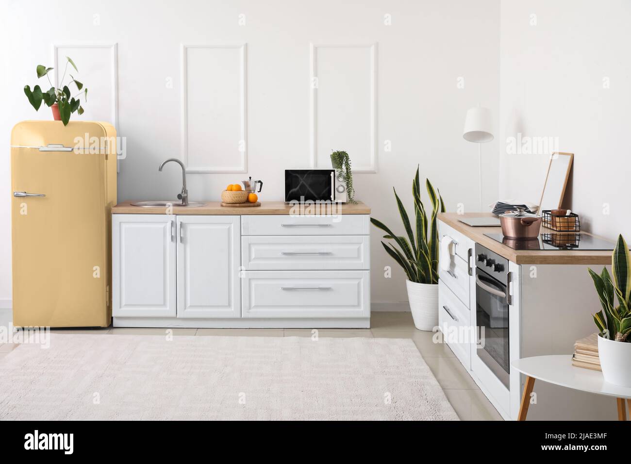 Interior of light modern kitchen with stylish yellow refrigerator Stock ...