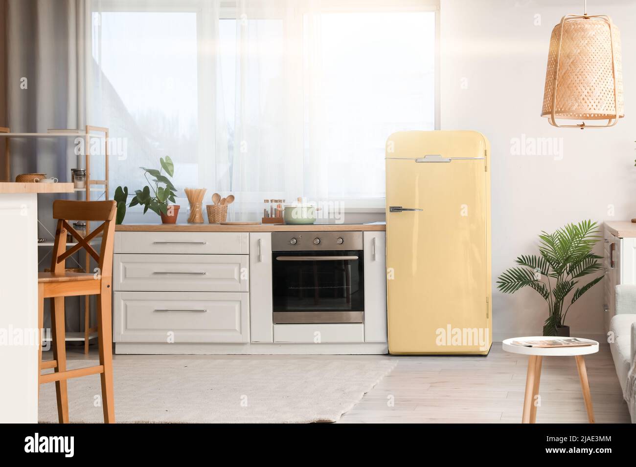 Interior of modern kitchen with yellow fridge and oven Stock Photo - Alamy
