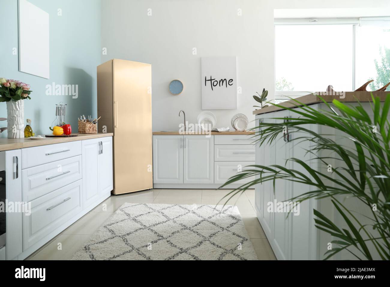 Interior of modern comfortable kitchen with refrigerator Stock Photo ...