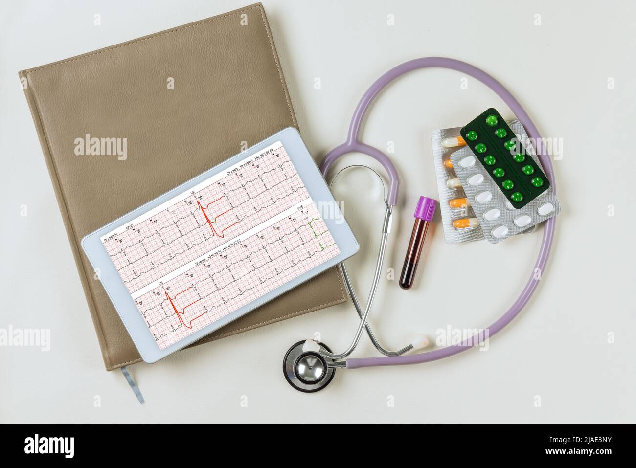 An heart report analysis the electrocardiogram viewed on digital tablet ...
