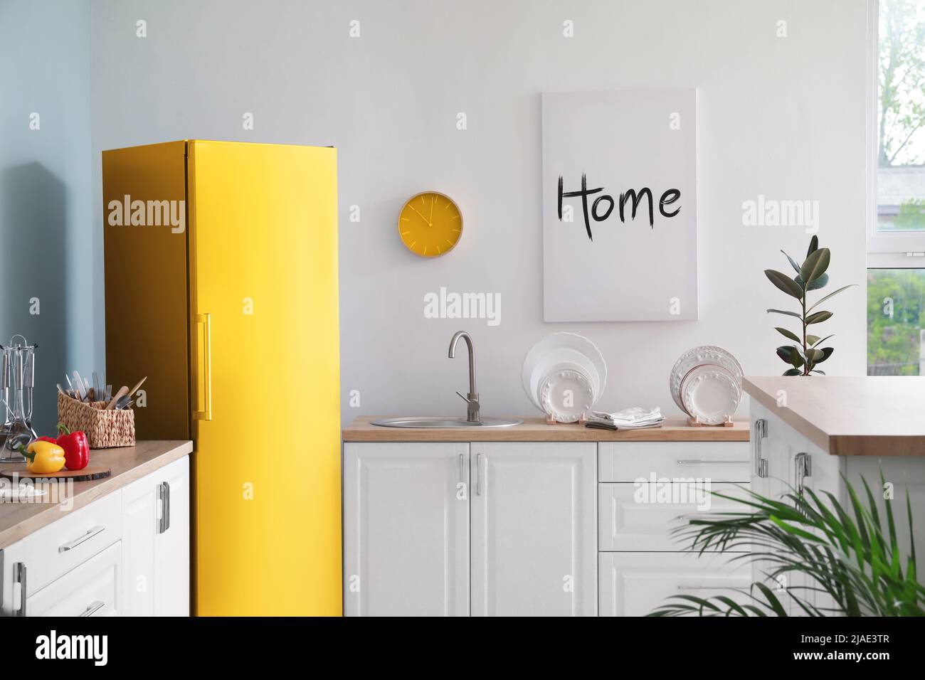 Stylish interior of modern light kitchen with yellow fridge Stock Photo ...