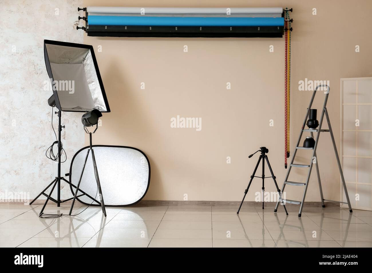 Lighting equipment, cyclorama and ladder in modern photo studio Stock ...