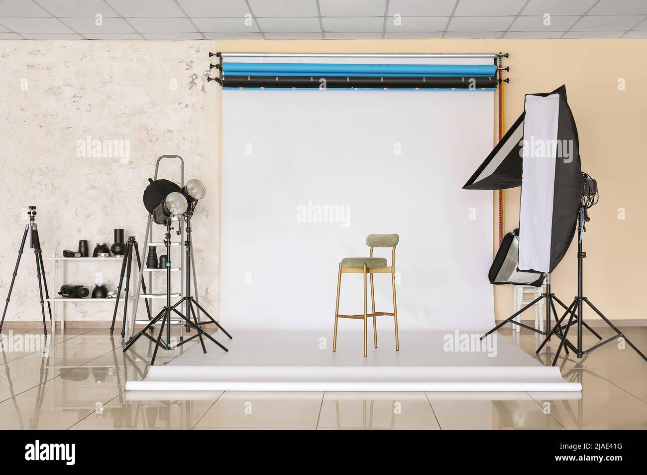 Lighting equipment, chair and cyclorama in modern photo studio Stock ...