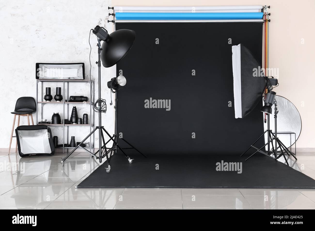 Lighting equipment, chair and cyclorama in modern photo studio Stock ...