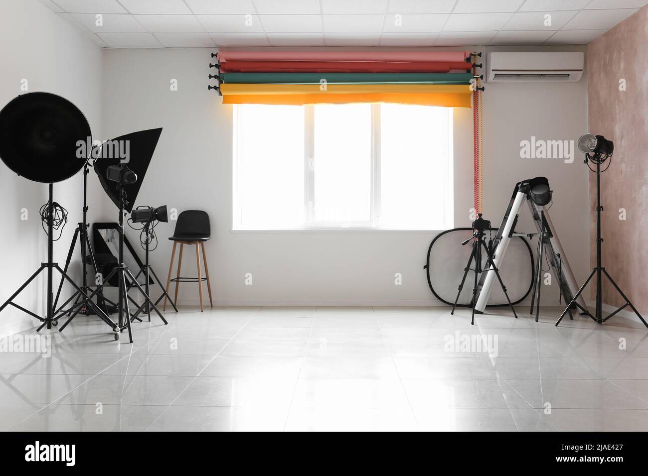 Lighting equipment and cyclorama in modern photo studio Stock Photo - Alamy