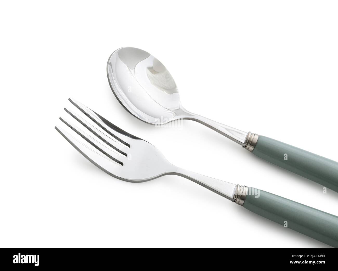 Stainless steel spoon and fork with green handle on white background ...