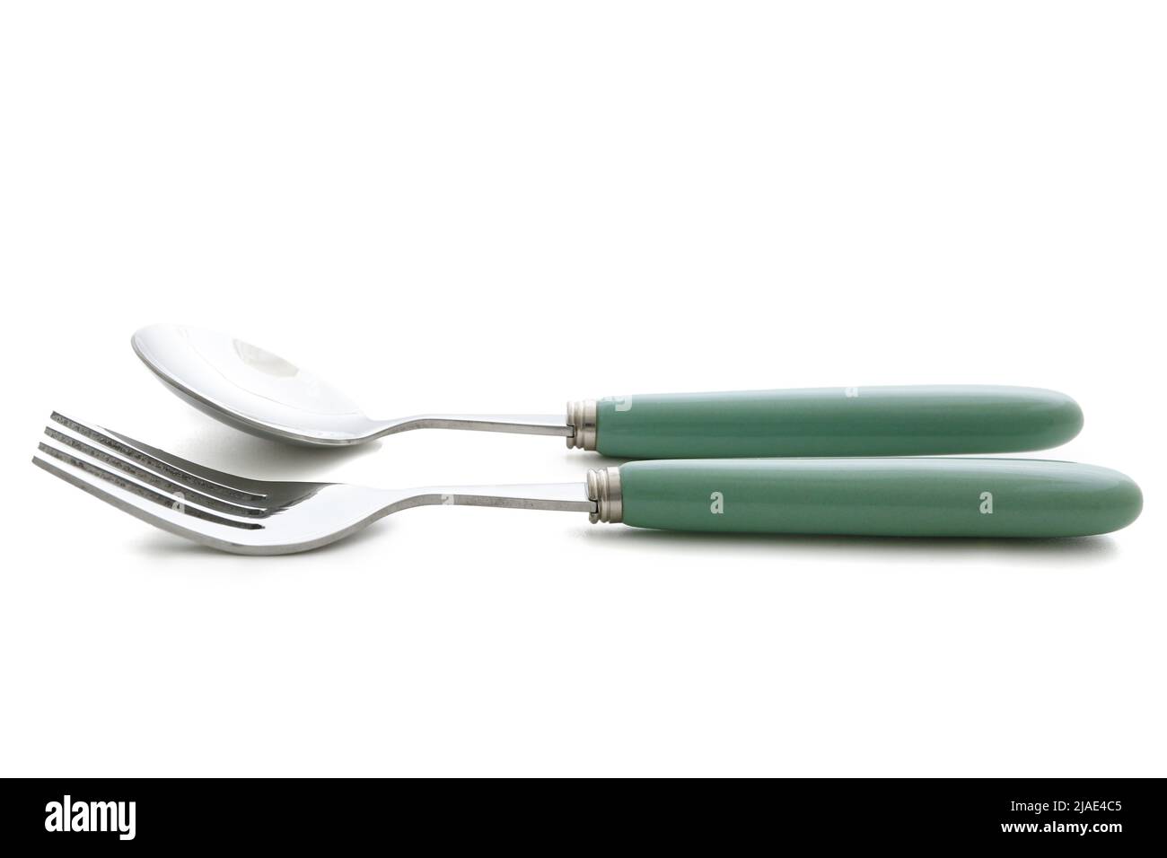 Stainless steel spoon and fork with green handle on white background ...
