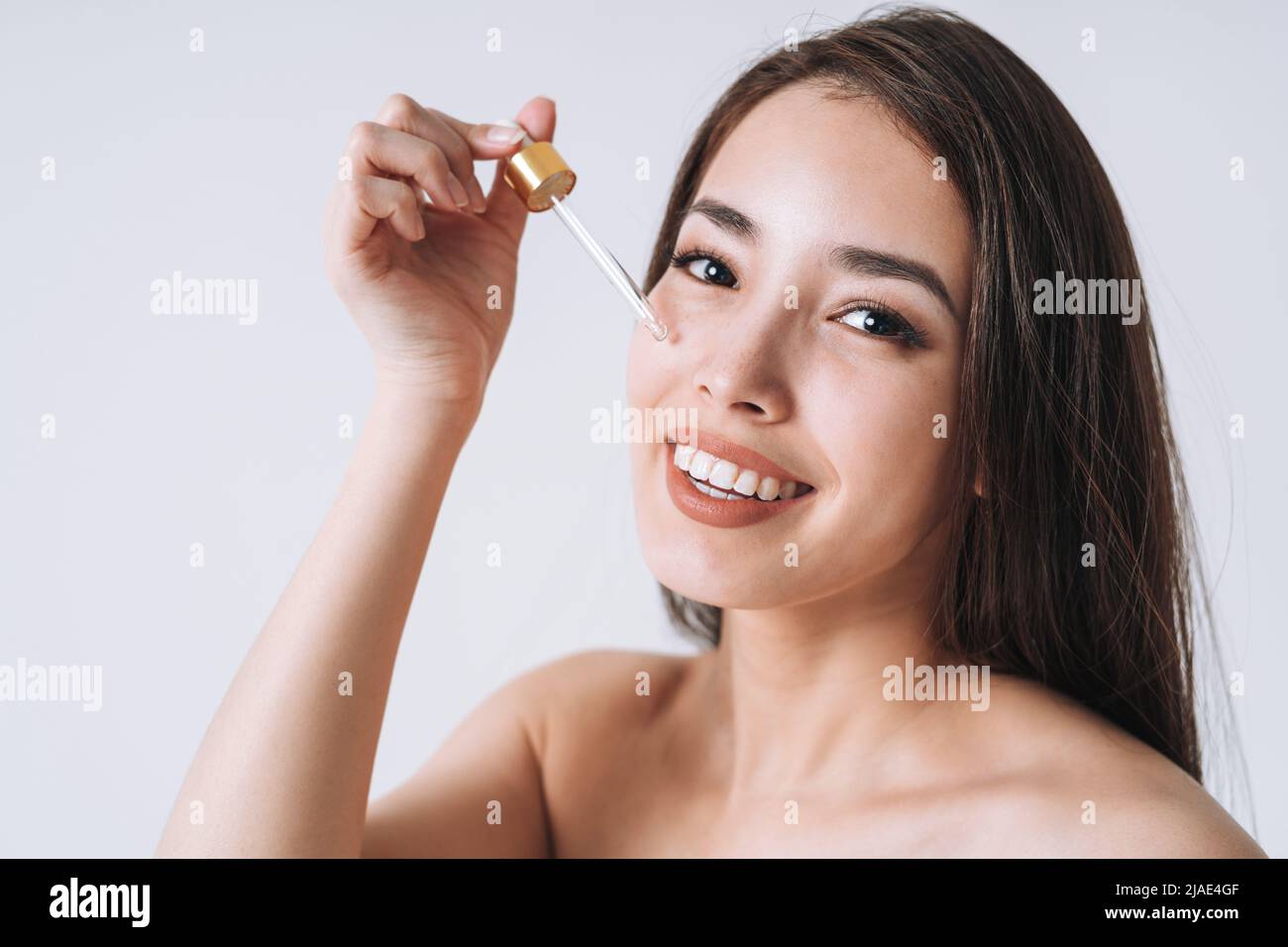 Beauty portrait of happy smiling asian woman with dark long hair with ...