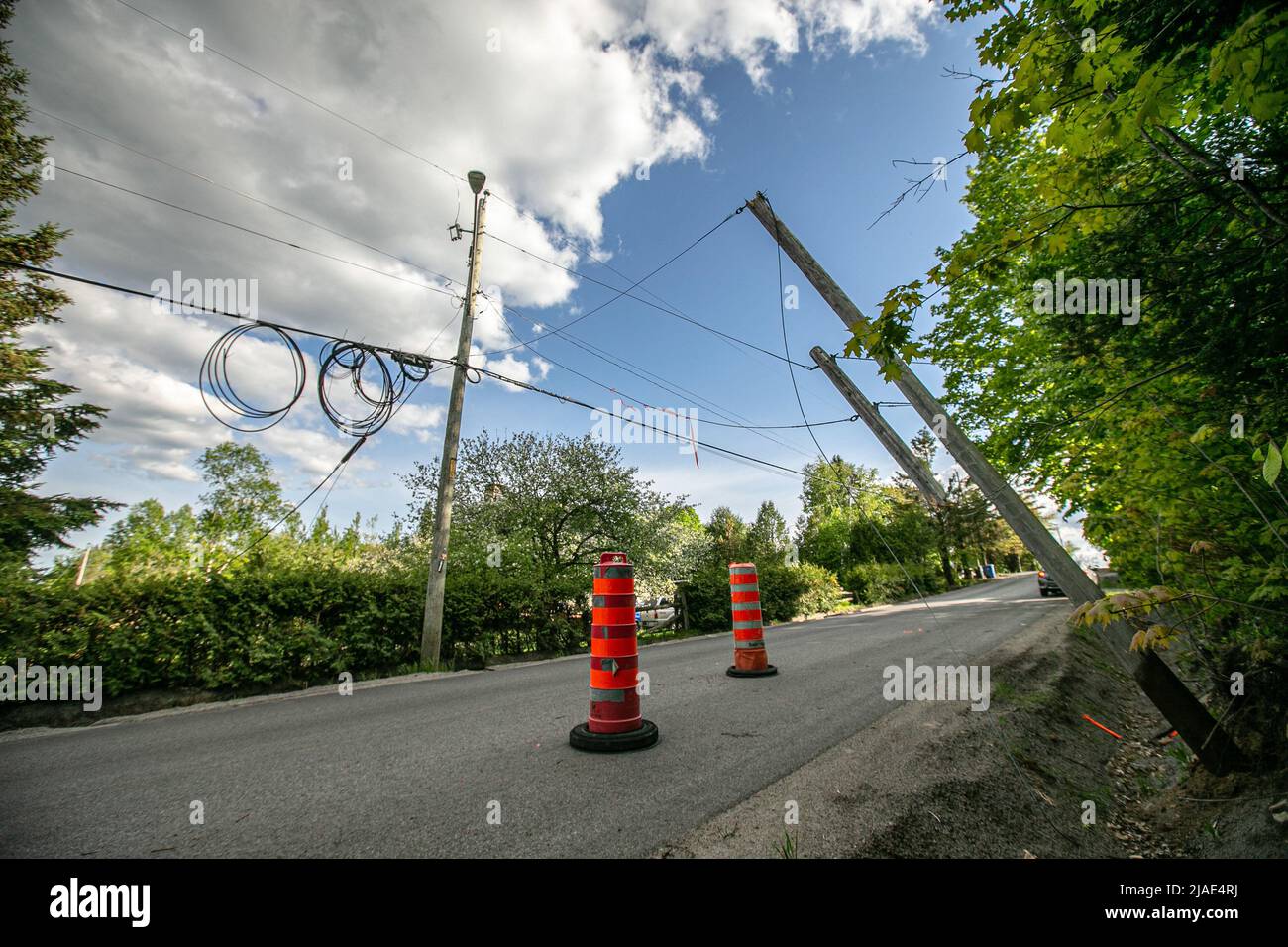 A half-fallen electric post taken from its place by the strong winds ...