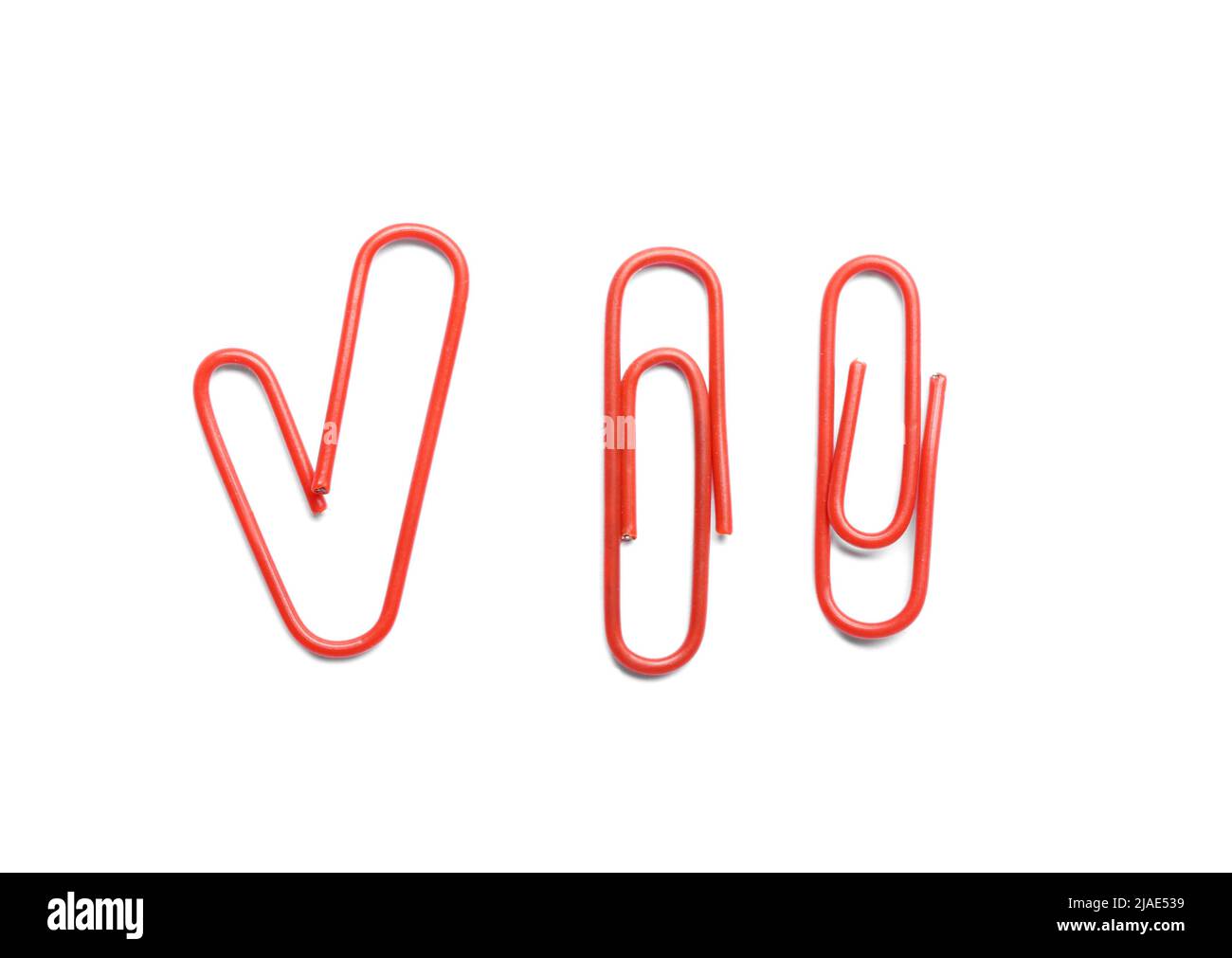 Red paper clips on white background Stock Photo - Alamy