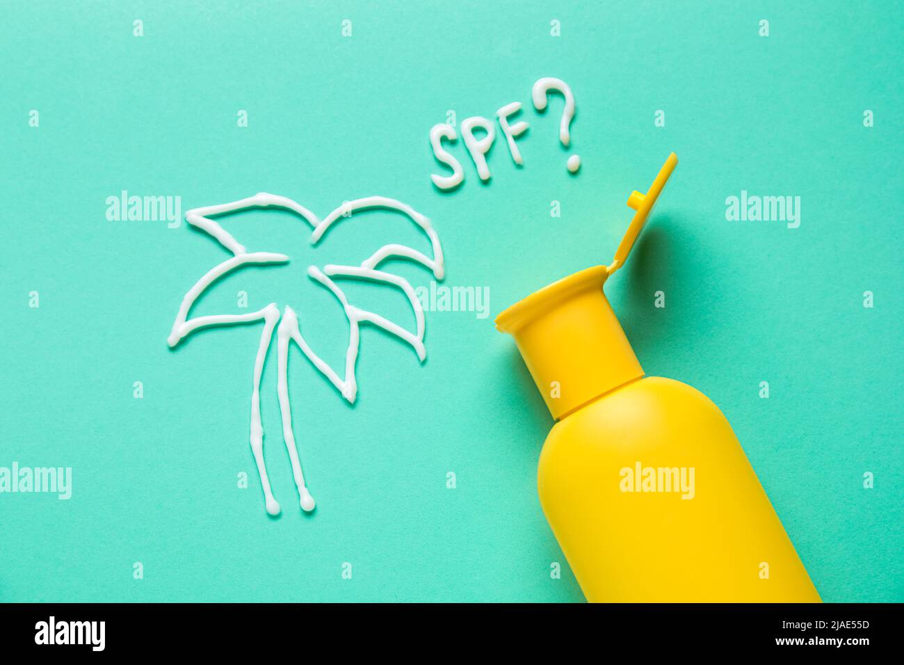 Drawing of palm tree and question SPF? made with sunscreen cream on ...