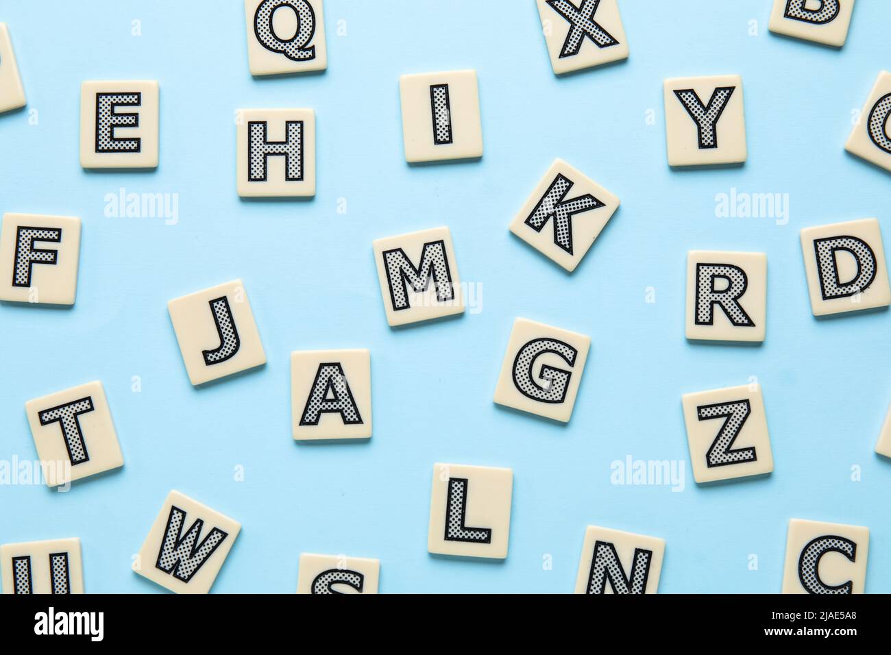 Different letters on blue background. Alphabet concept Stock Photo - Alamy