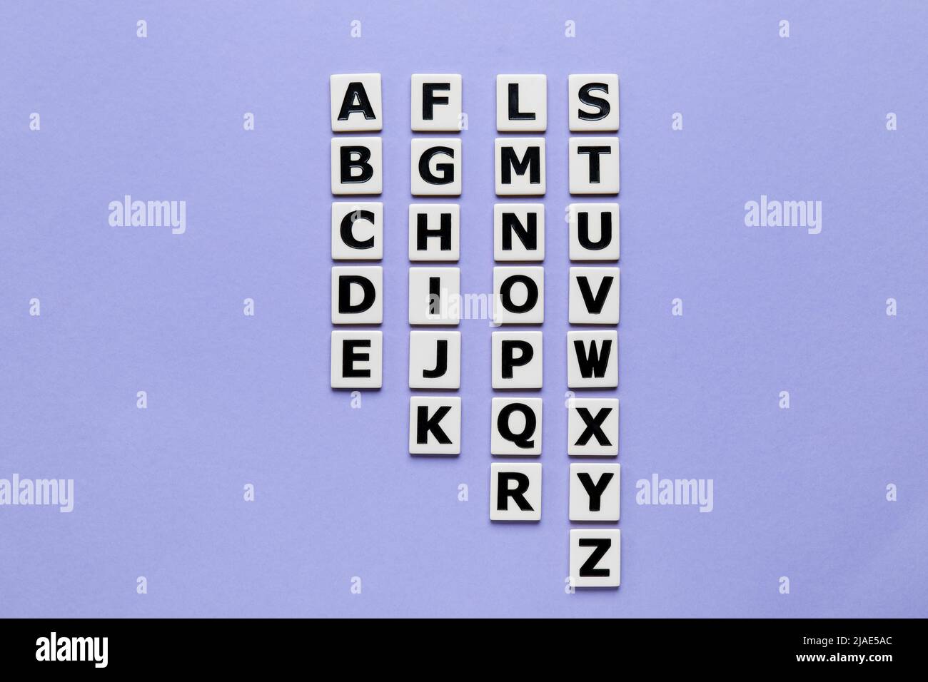 Letters on violet background. Alphabet concept Stock Photo - Alamy