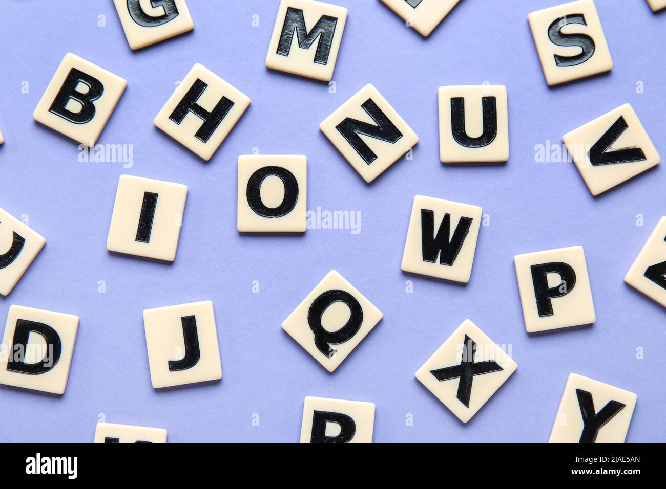 Different letters on violet background. Alphabet concept Stock Photo ...