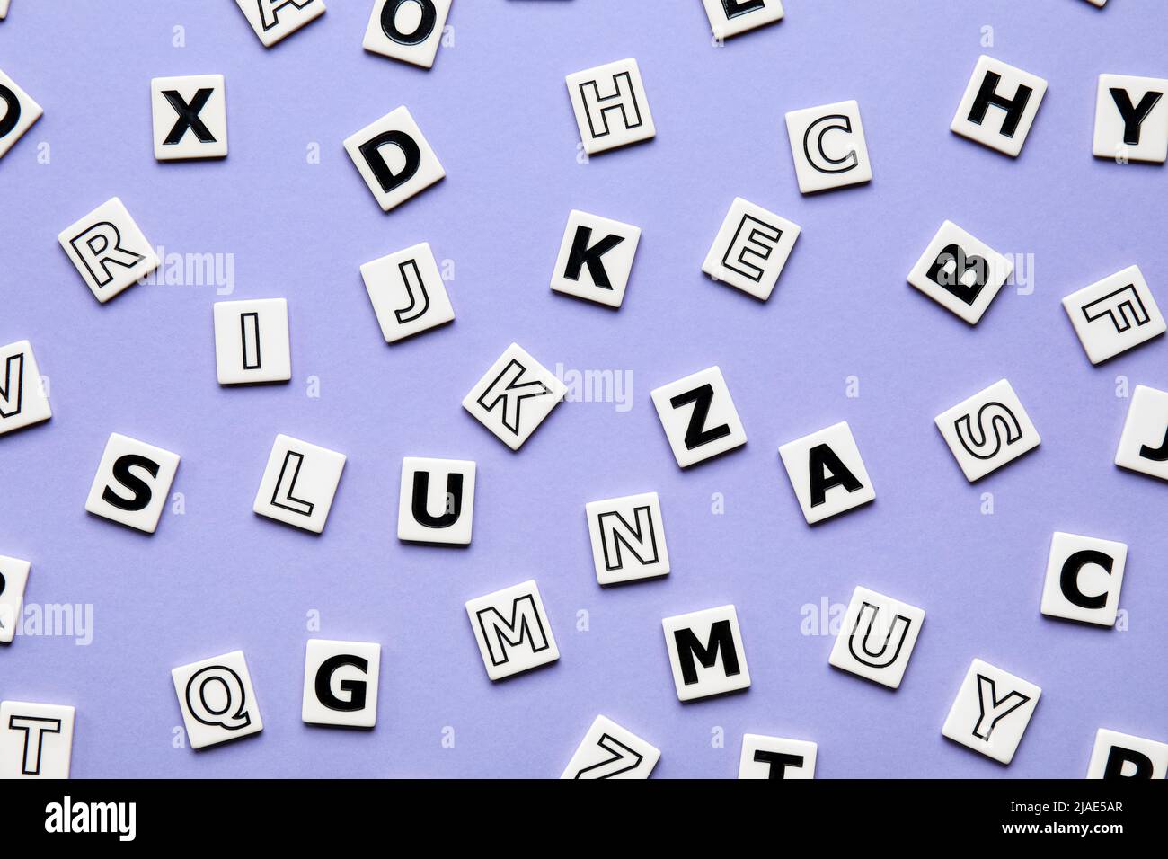 Different letters on violet background. Alphabet concept Stock Photo ...
