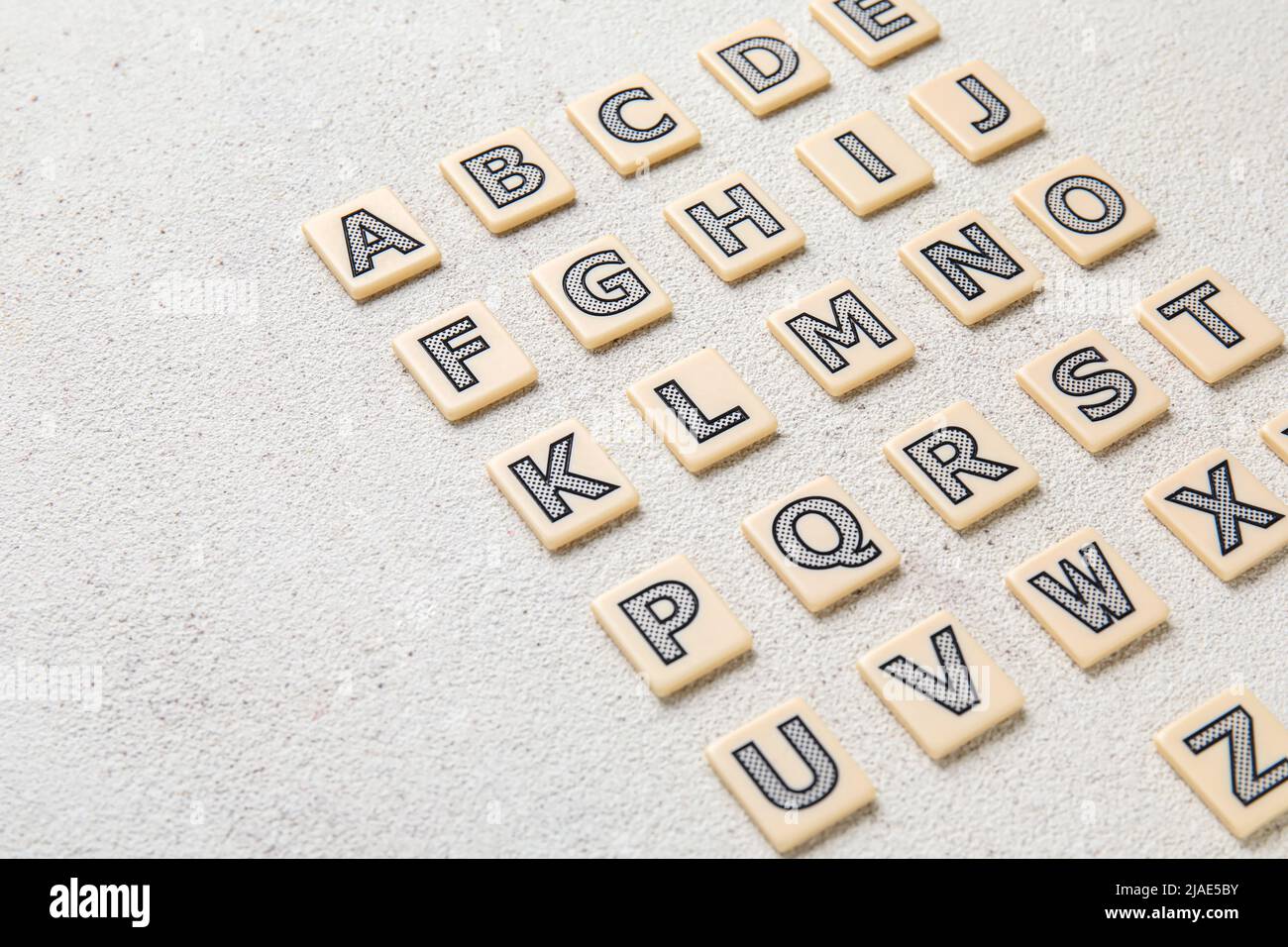 Different letters on white background. Alphabet concept Stock Photo - Alamy