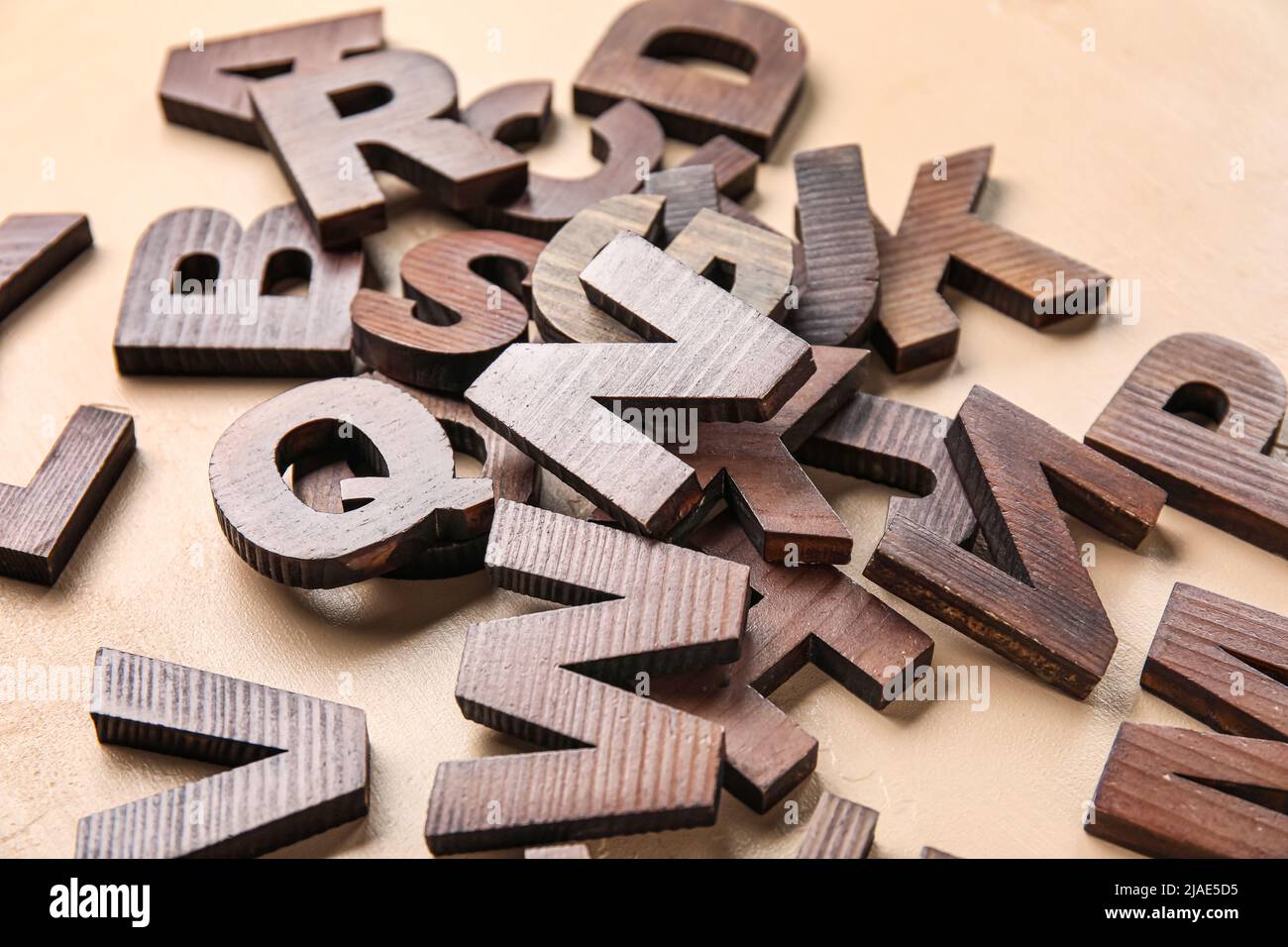 Wooden letters on beige background, closeup. Alphabet concept Stock ...