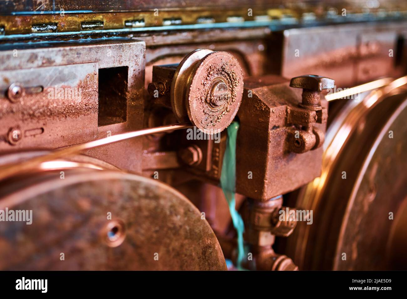Copper wire straightener machine tool in plant workshop Stock Photo - Alamy