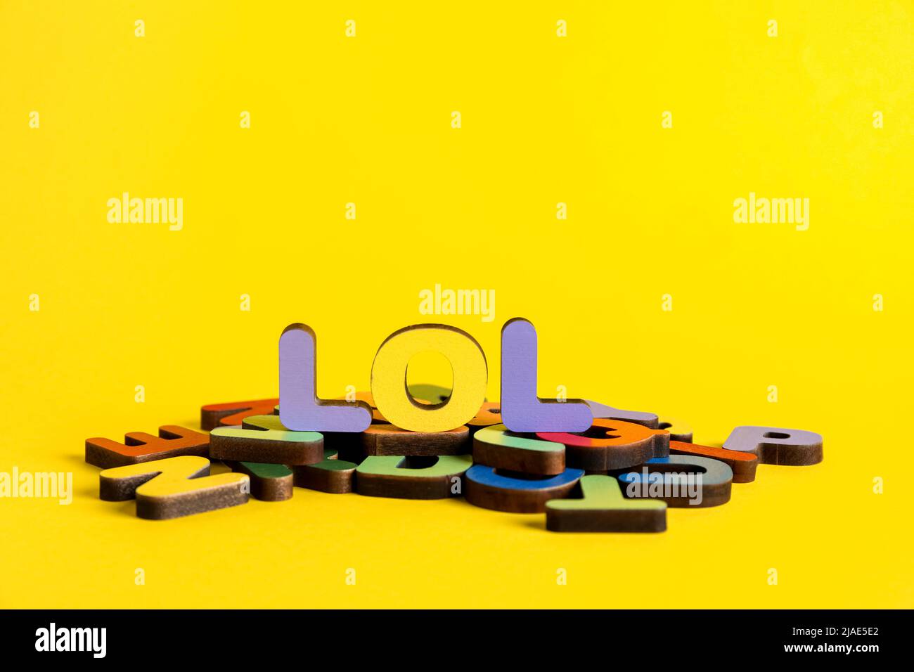 Word LOL with letters on yellow background. Alphabet concept Stock ...