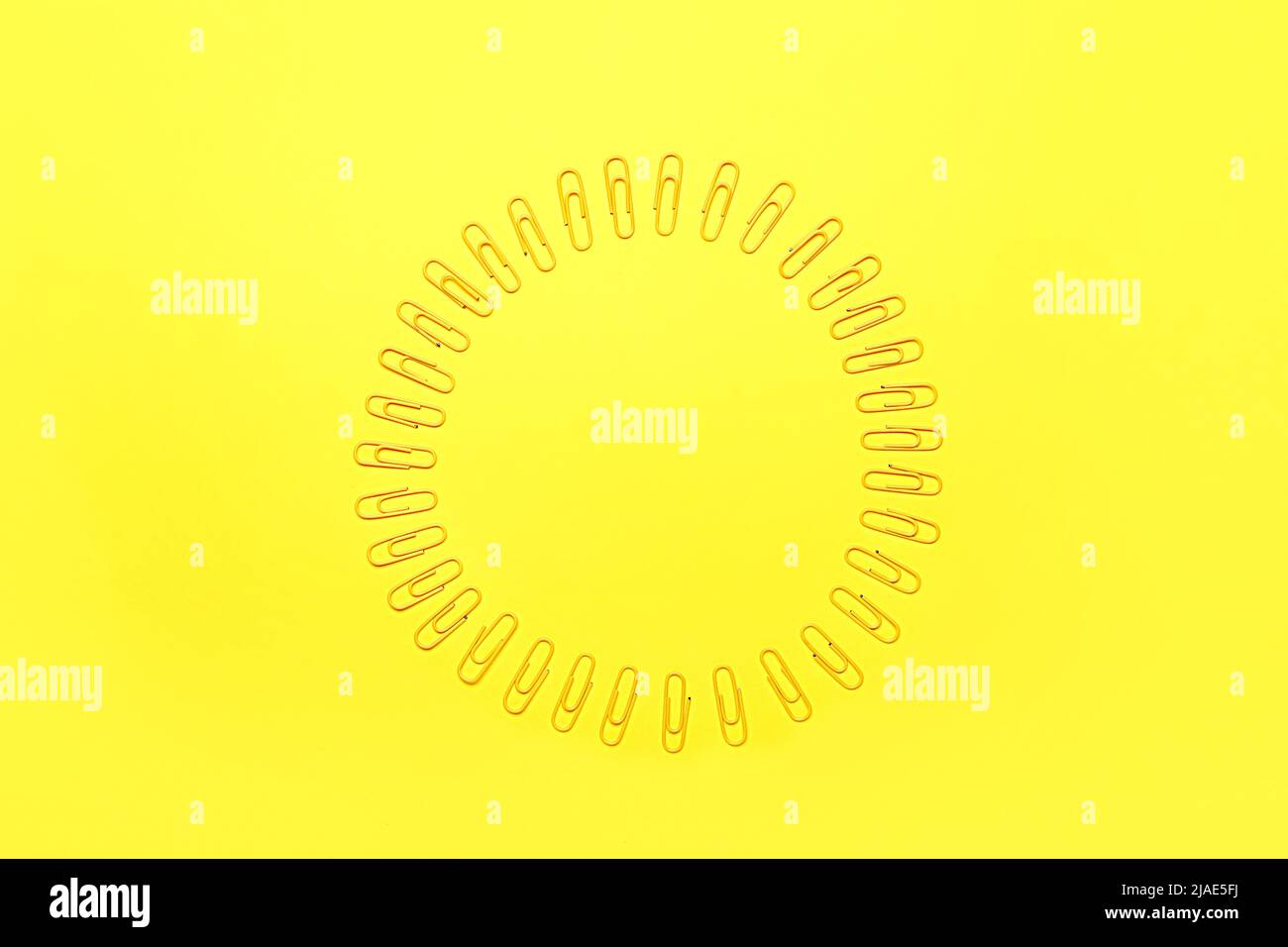 Frame made of yellow paper clips on color background Stock Photo - Alamy
