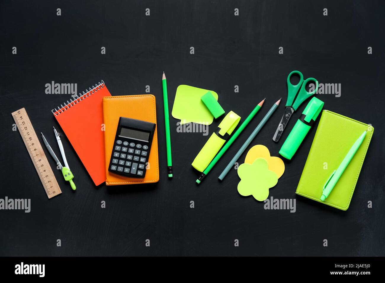 Stationery supplies on school blackboard Stock Photo - Alamy