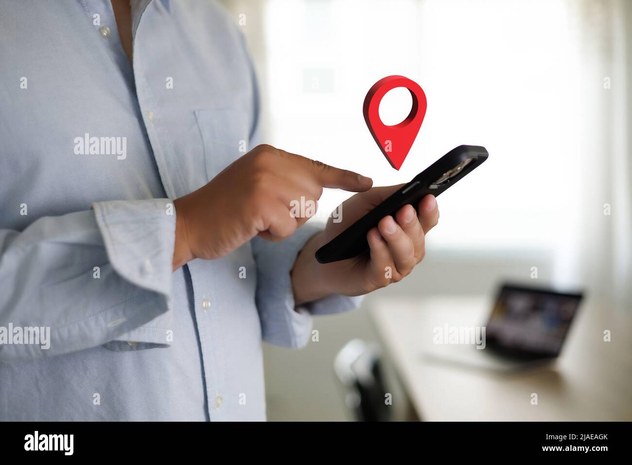 hand using a smartphone Holding GPS Map to Route Destination network ...