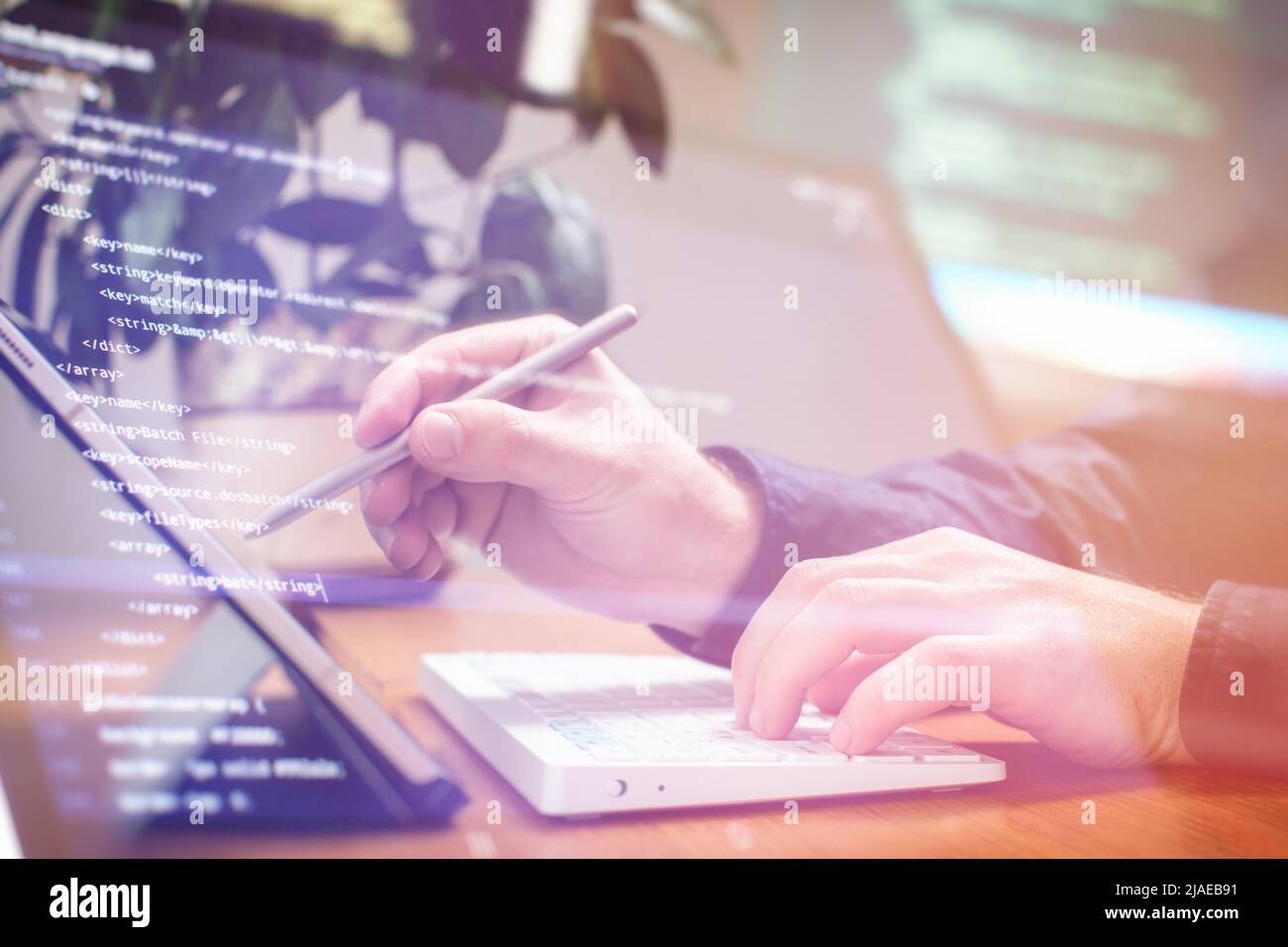 Businessman working with laptop computer on wooden desk in modern ...