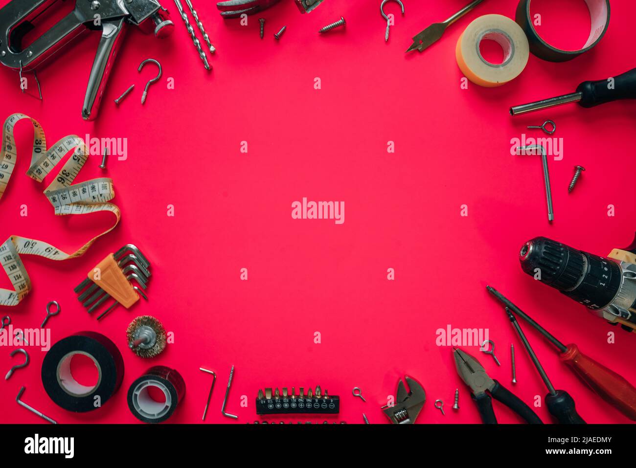 construction tools on a pink background Stock Photo - Alamy