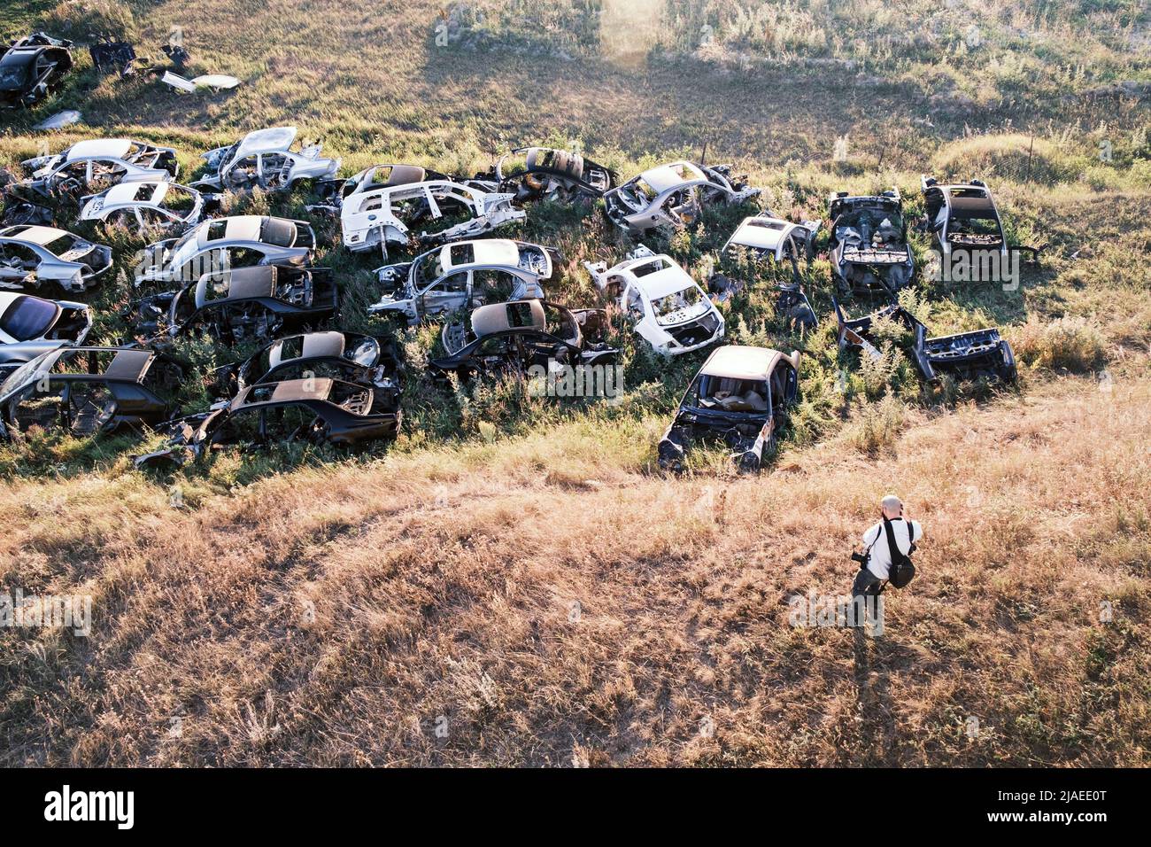 Junkyard, car dump, scrap metal. Bunch of damaged broken rusty cars ...