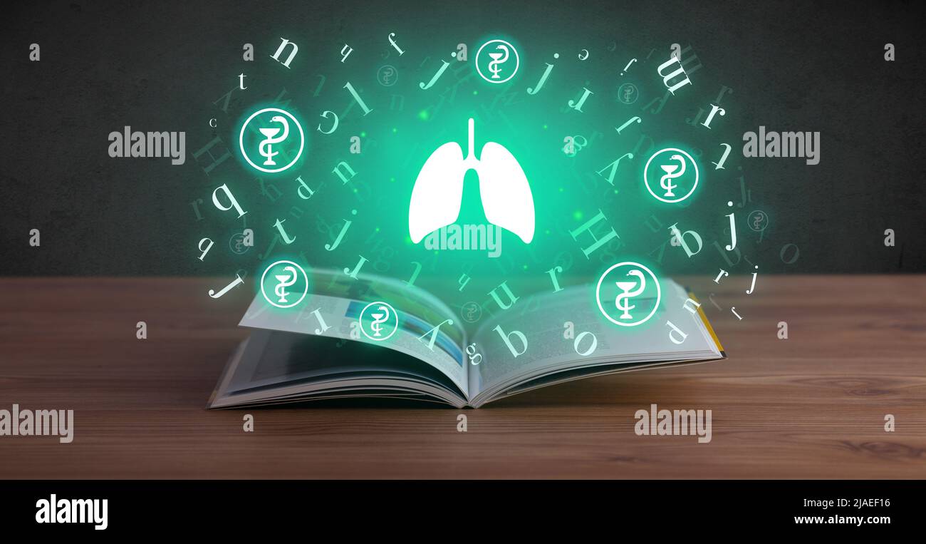 Open medical book with health icons above Stock Photo - Alamy