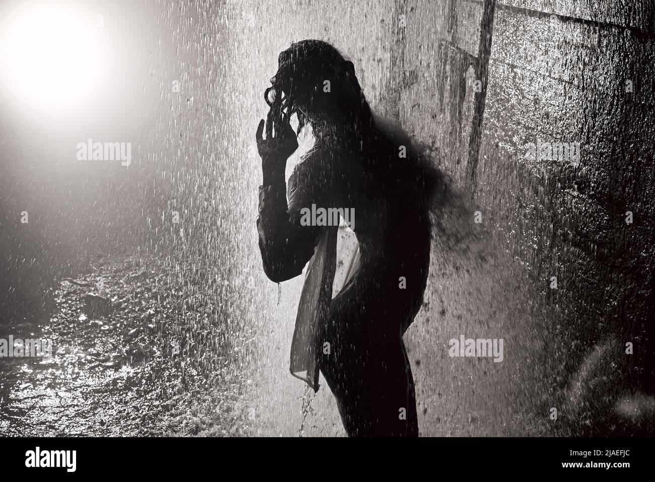 Girl dancing in the waterfall Stock Photo - Alamy