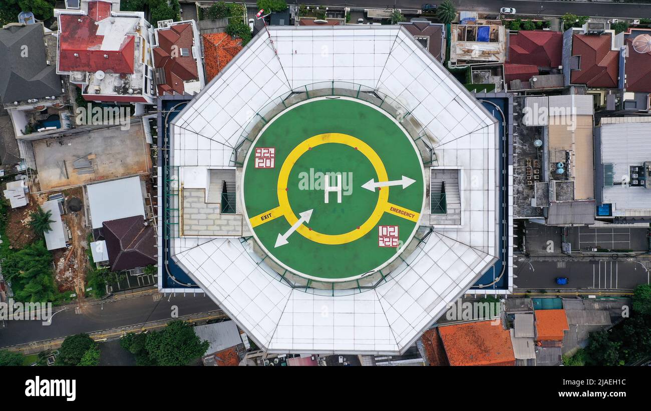Top down view of helicopter landing pad on the roof of modern ...