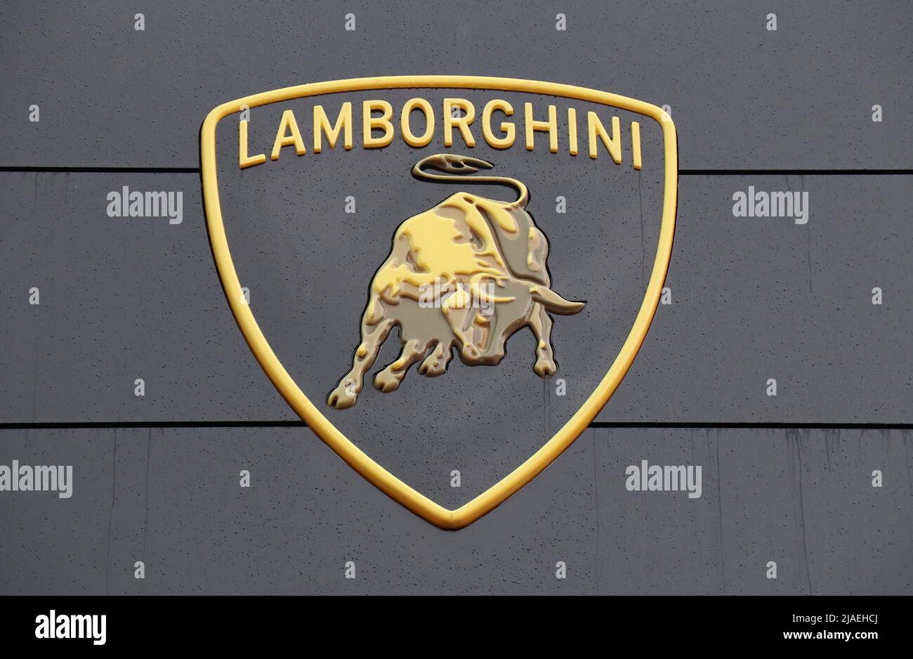 The main logo of Lamborghini sport cars on the wall. Italy Stock Photo ...