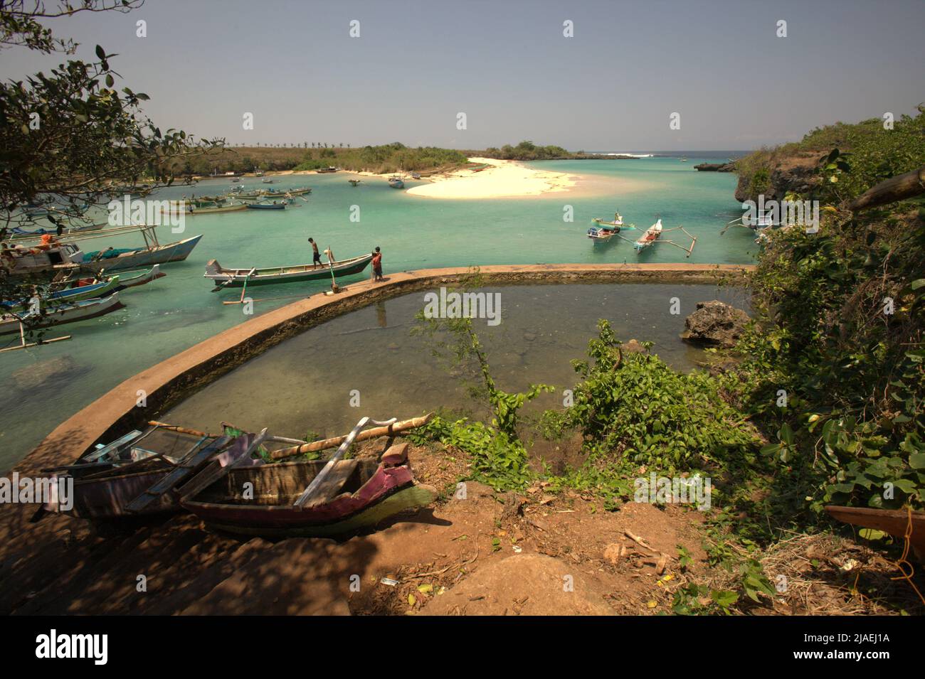 Fishing boats and a concrete pathway on Pero beach in Pero Batang ...
