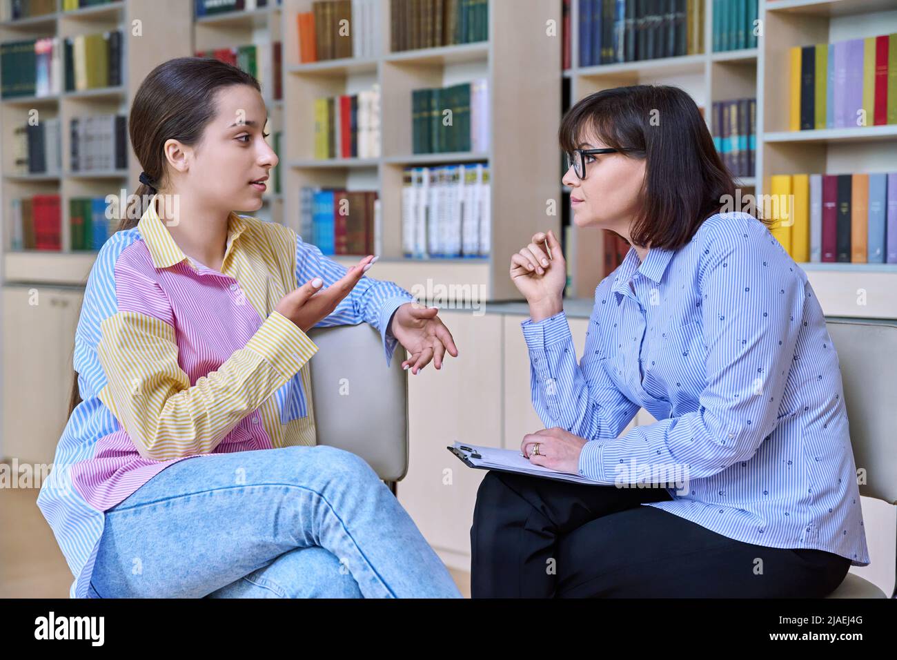 Psychologist, high school behavior counseling teenage student in ...