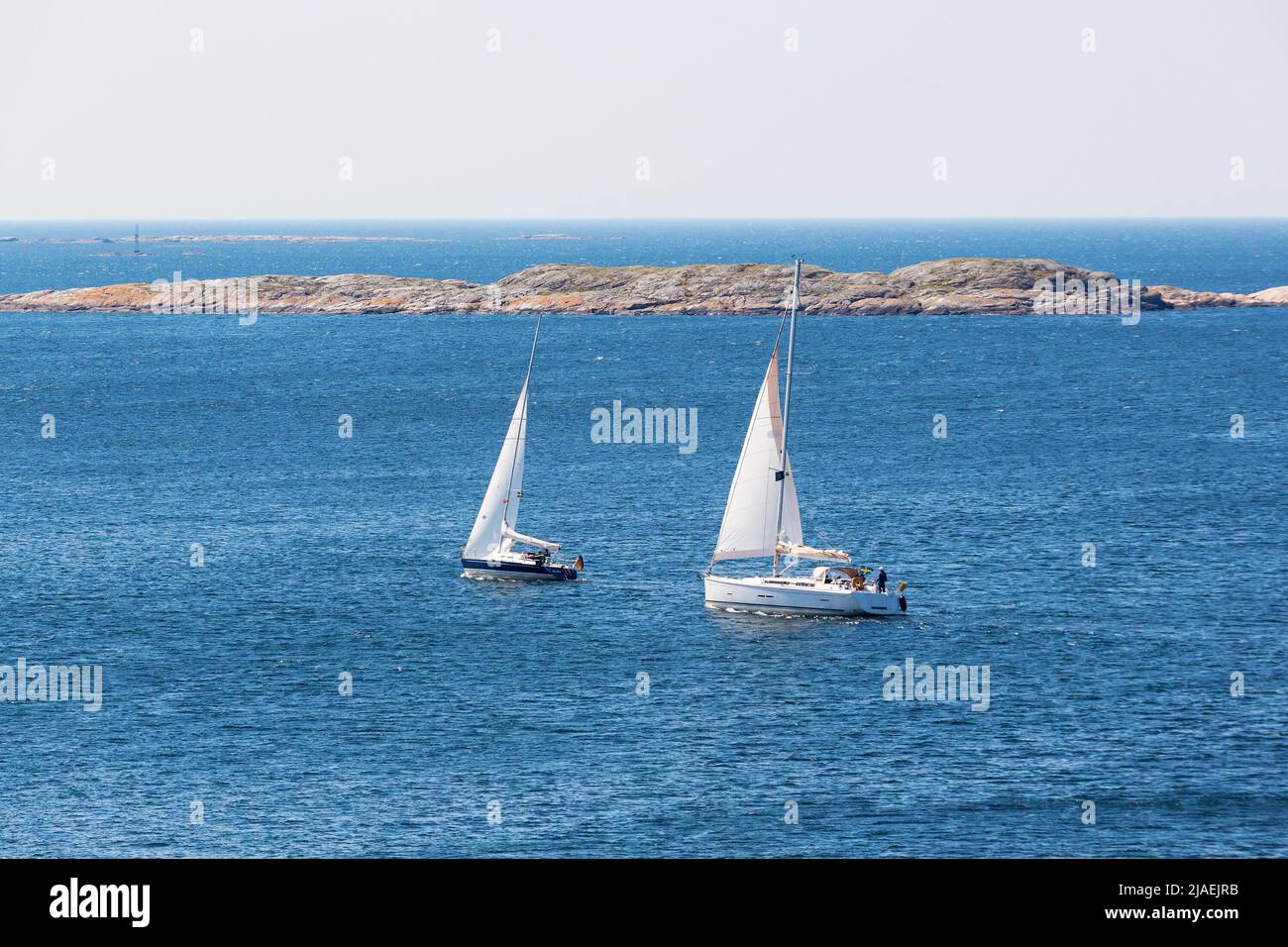 Two sailboats sailing on the coast Stock Photo - Alamy