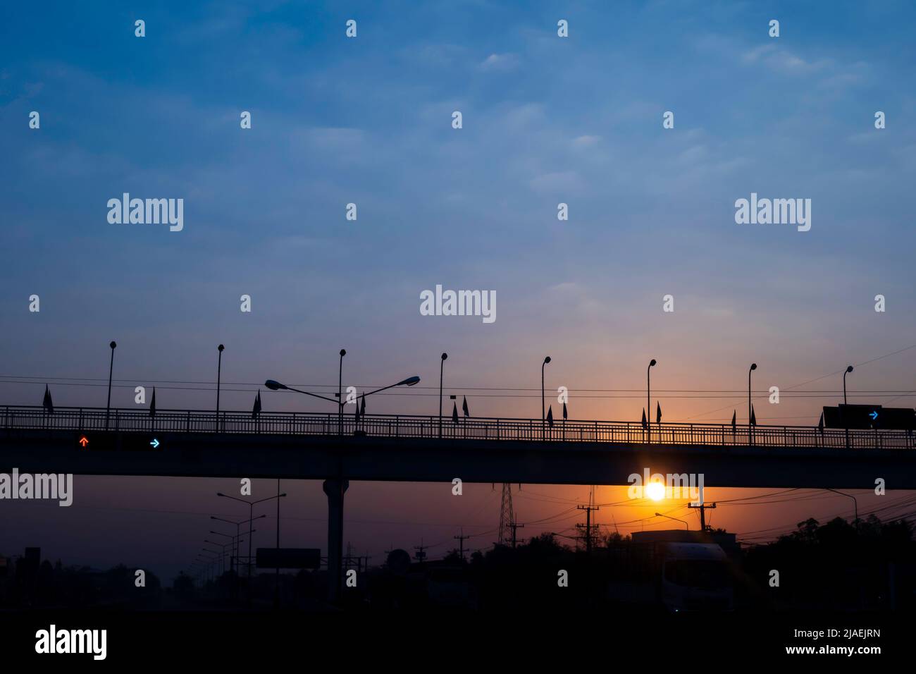 Silhouette of highway overpass with sunrise sky background Stock Photo ...