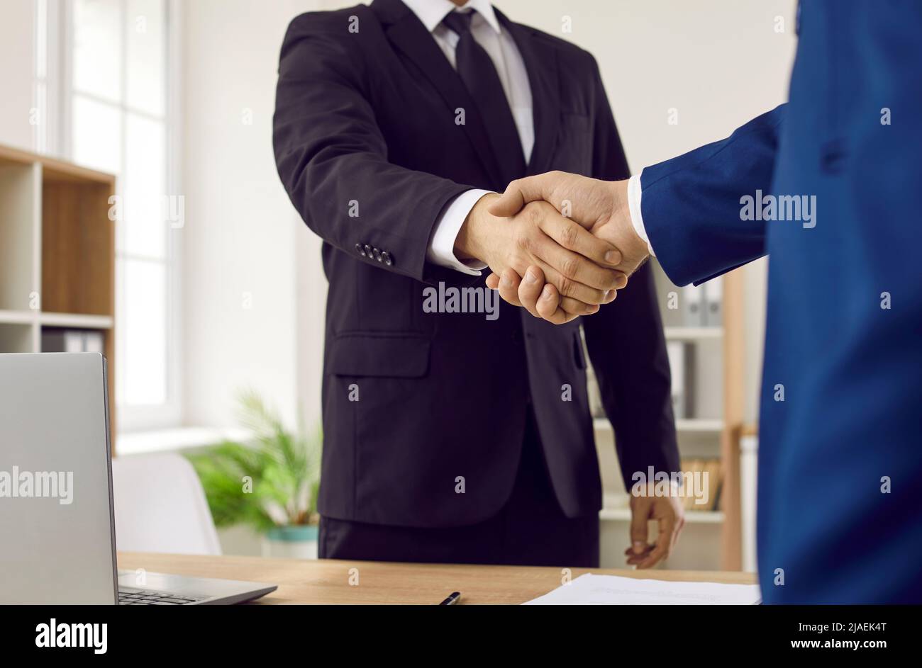 Handshake after successful consultation or negotiation between lawyer ...