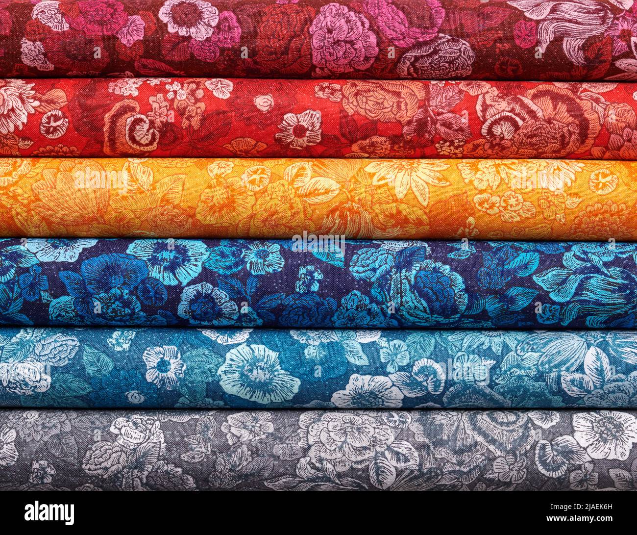 Stack of colorful cotton quilting fabrics as a background image Stock ...