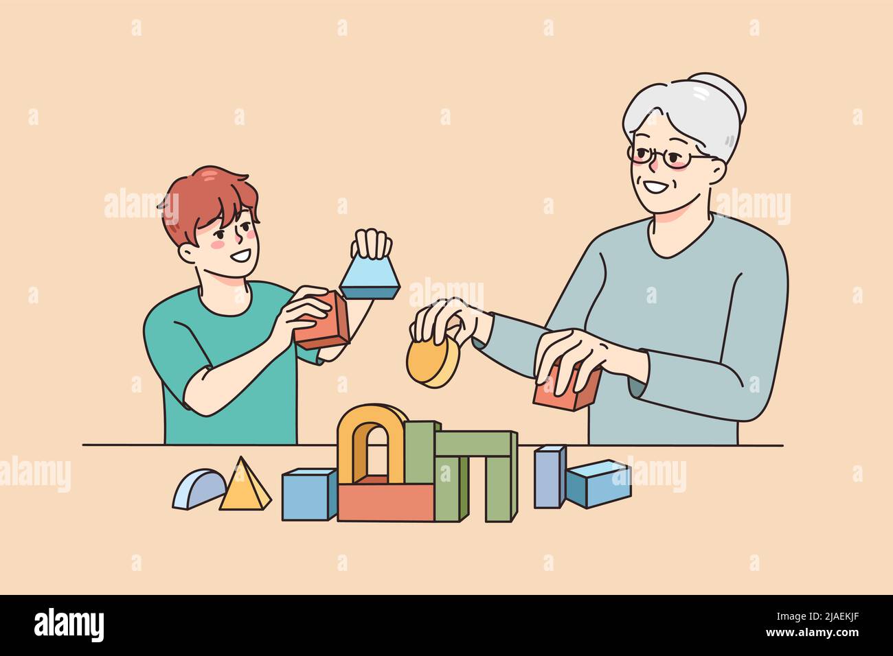 Loving elderly grey-haired grandmother play toys with small grandchild ...