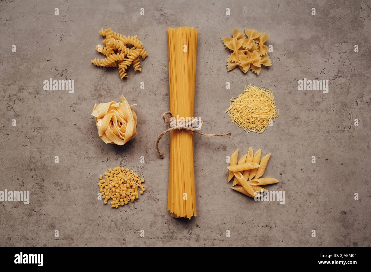 Flat Lay of Different Types of Pasta Laid Up Around Handful of ...