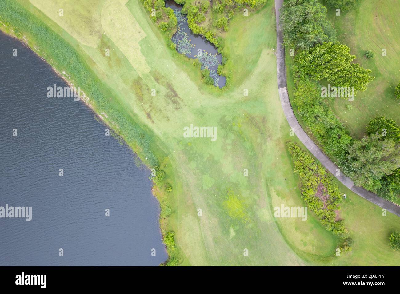 Aerial view drone shot of beautiful green golf field fairway and ...
