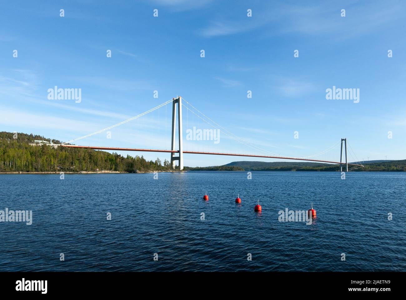 View of the High Coast Bridge, brackets, and buildings. Pylons, river ...